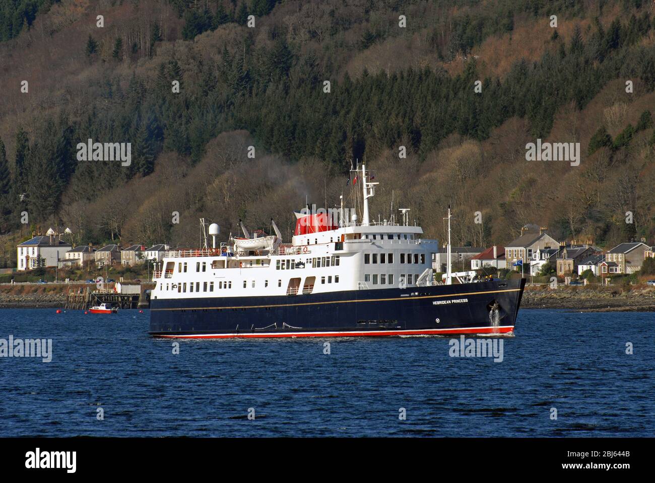 HEBRIDEAN PRINCESS cruising past the village of KILMUN, HOLY LOCH ...