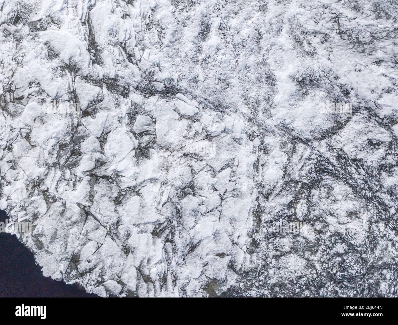 Aerial view of the ice texture broken into pieces of different shapes ...