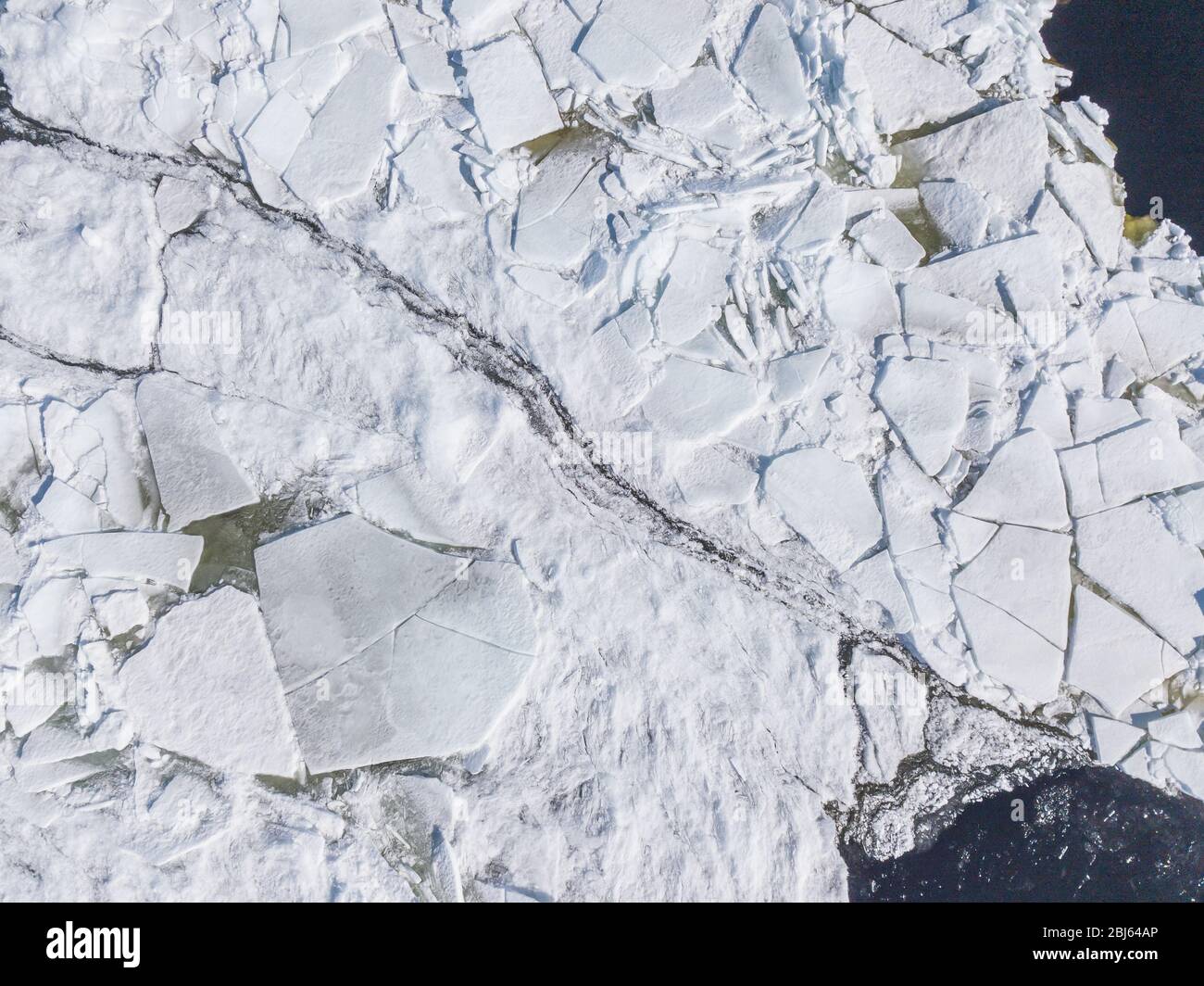 Aerial view of the ice texture broken into pieces of different shapes ...