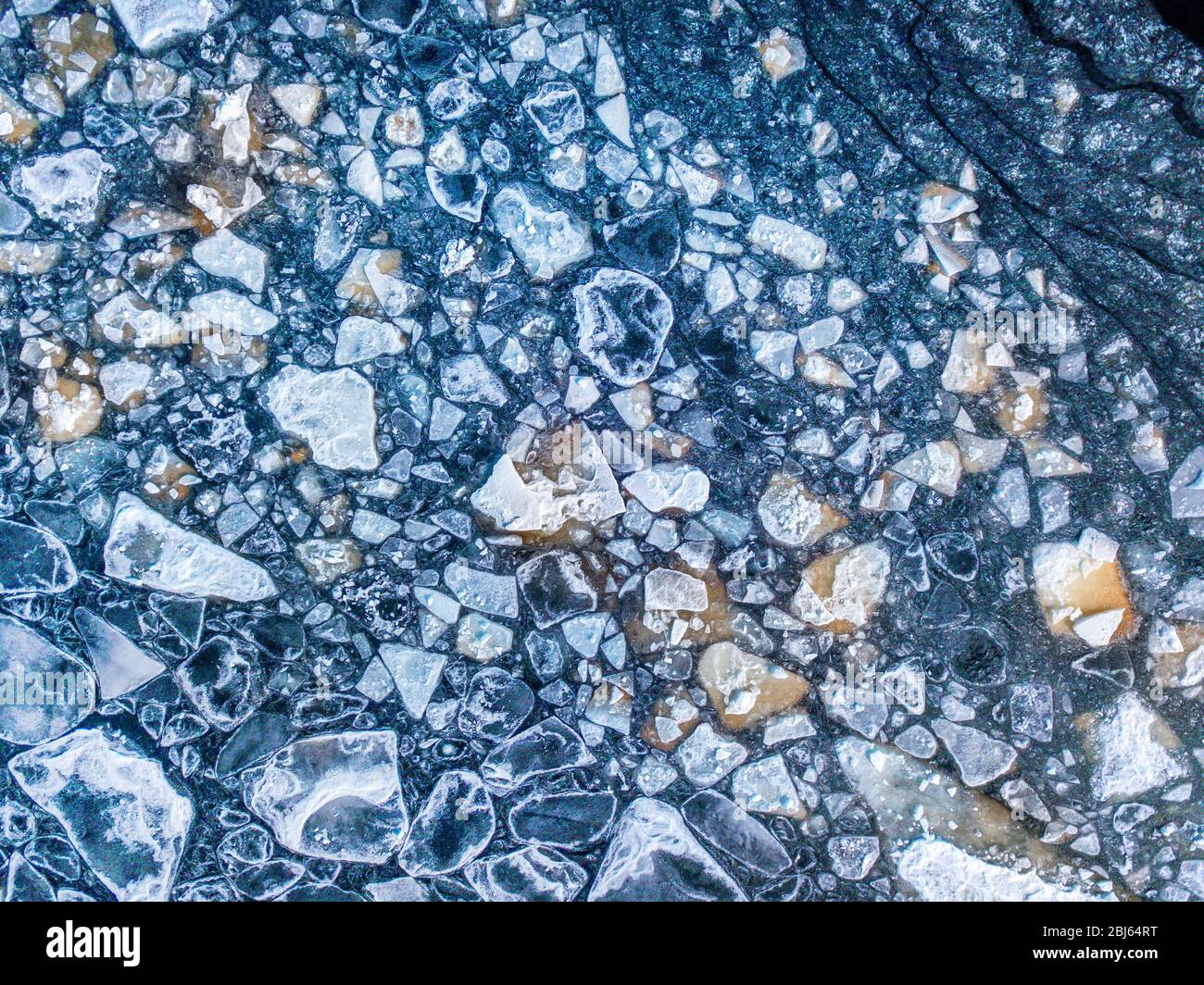 Aerial view of the ice texture broken into pieces of different shapes ...