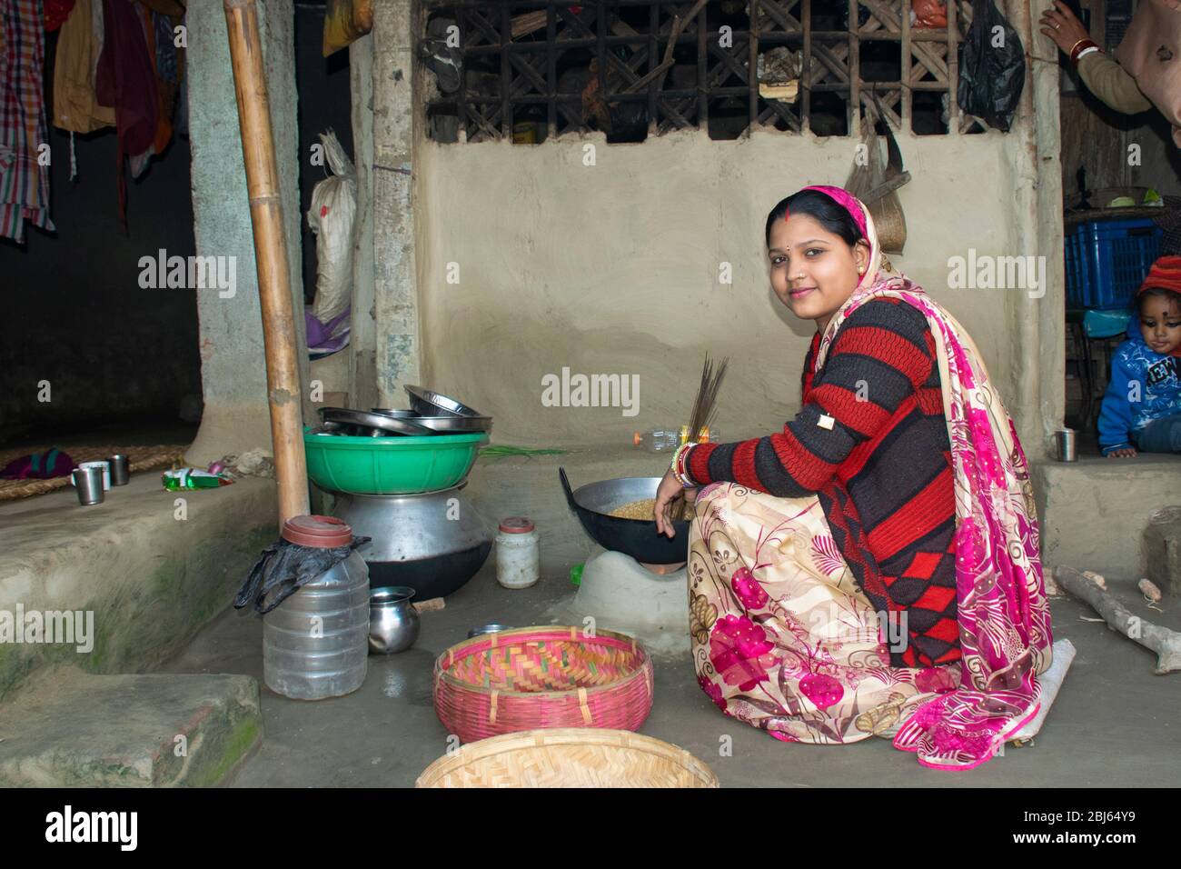 Rural Indian Woman cooking food in the Kitchen using firewood stove ...