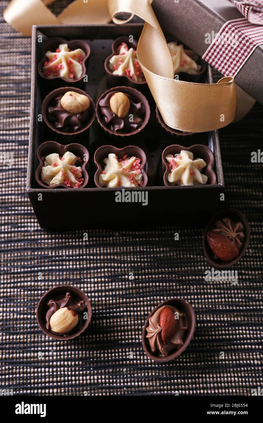 Chocolate sweets on fabric background Stock Photo - Alamy