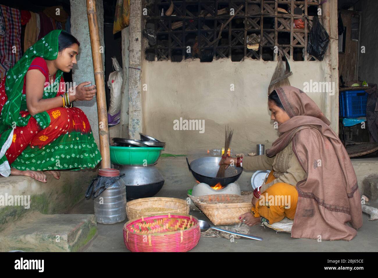 Rural Indian Woman cooking food in the Kitchen using firewood stove ...