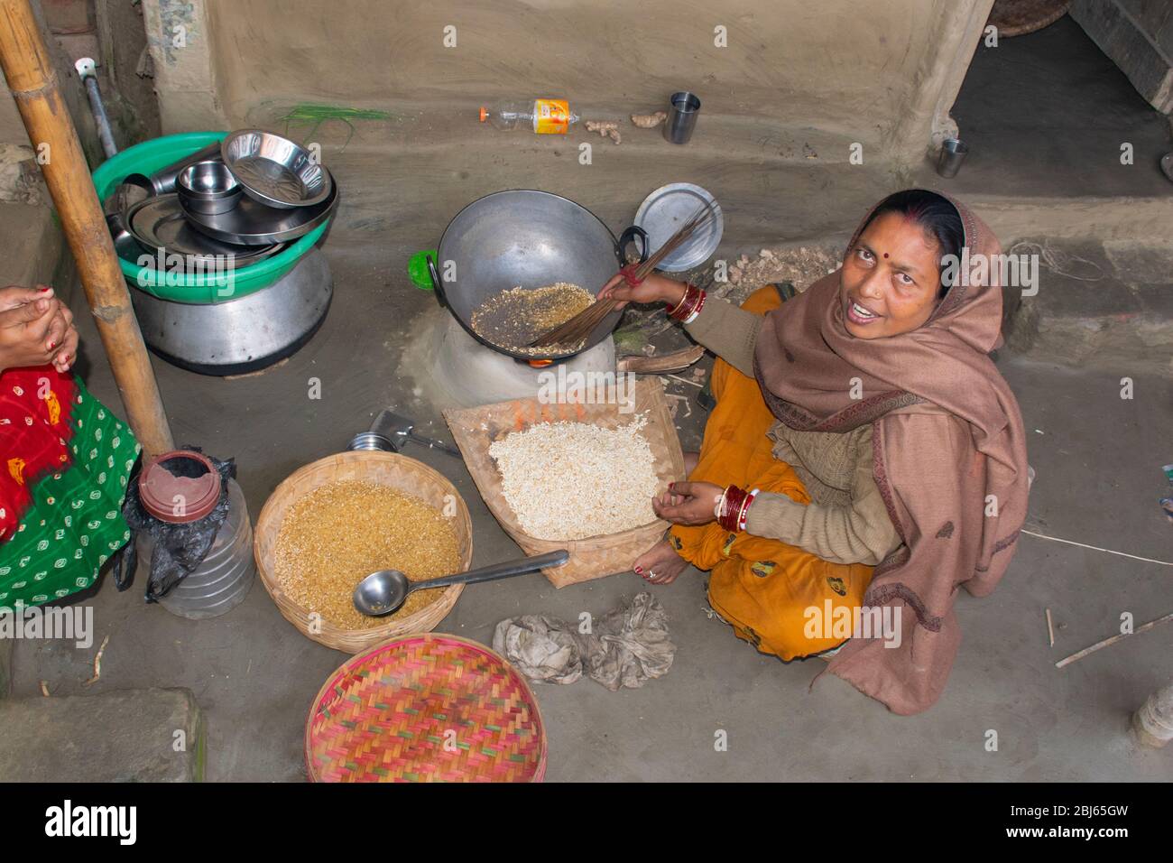 Rural Indian Woman cooking food in the Kitchen using firewood stove ...
