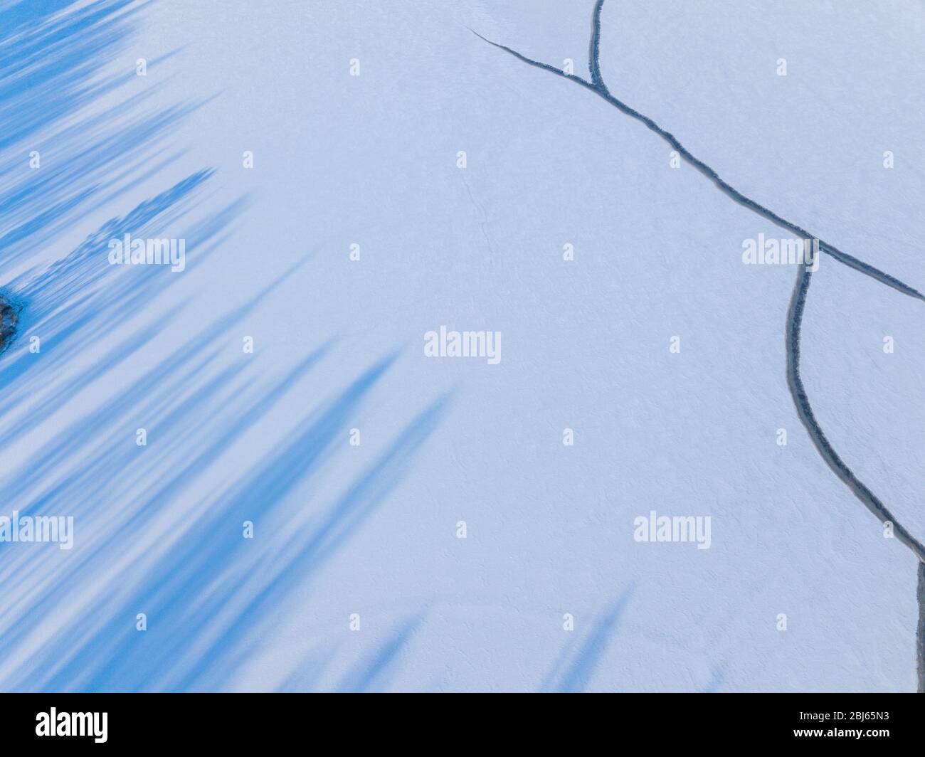 Aerial view of a rift on the ice of a winter lake Stock Photo - Alamy