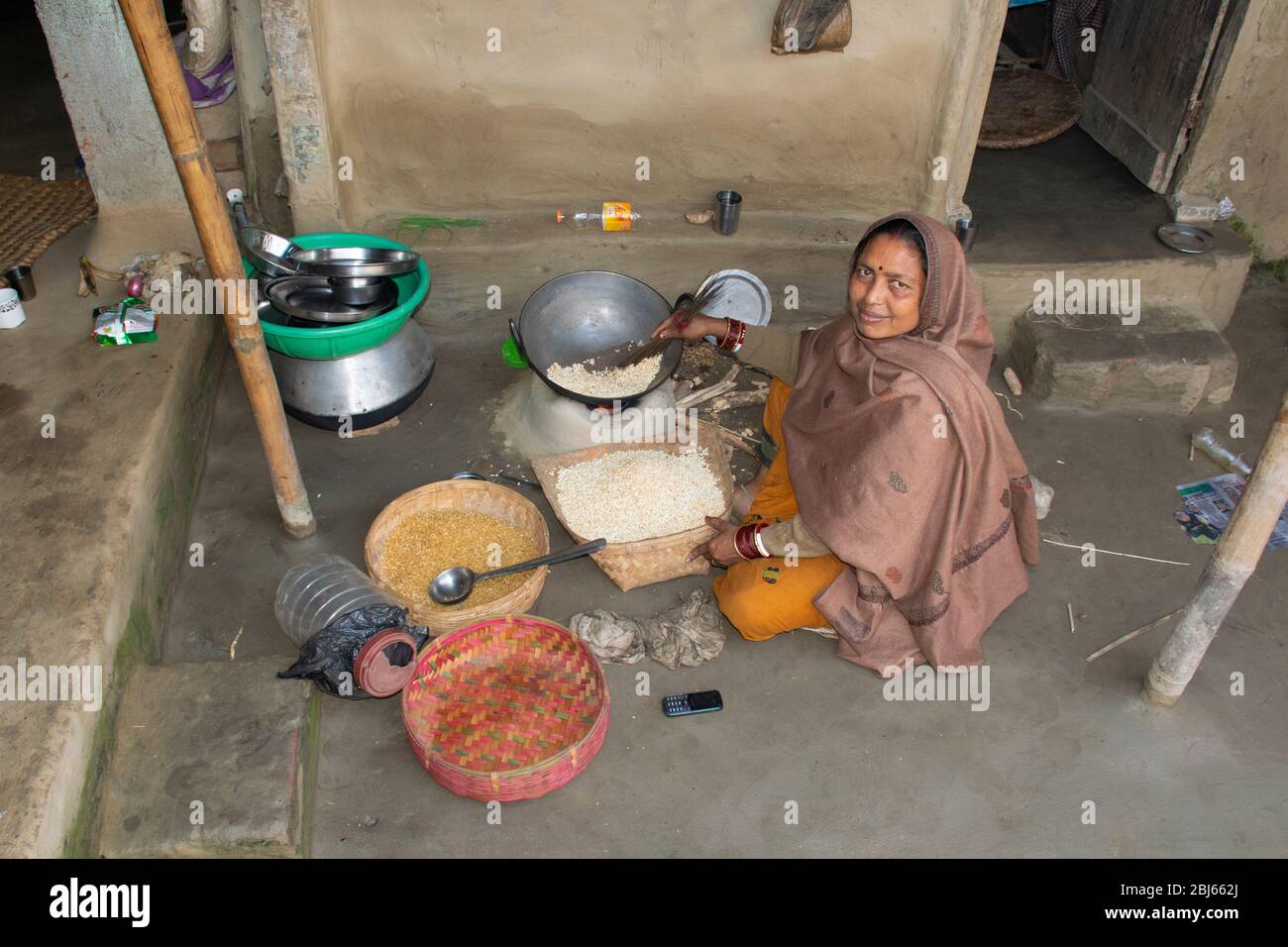 Rural Indian Woman cooking food in the Kitchen using firewood stove ...