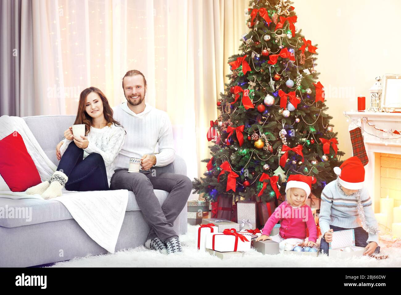 Christmas family portrait in home holiday living room Stock Photo - Alamy