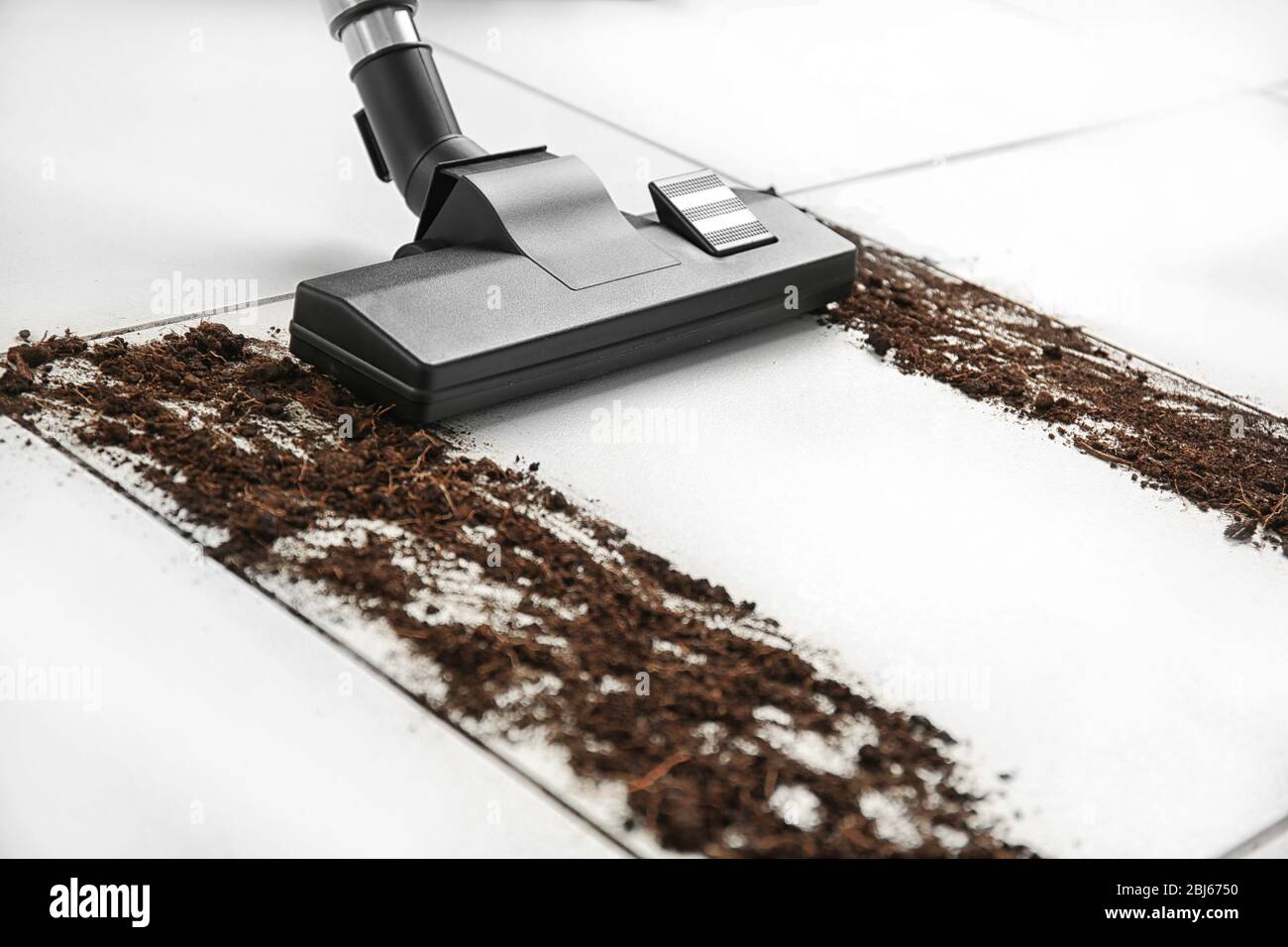 Cleaning concept - carpet sweeper and dust, close up Stock Photo - Alamy