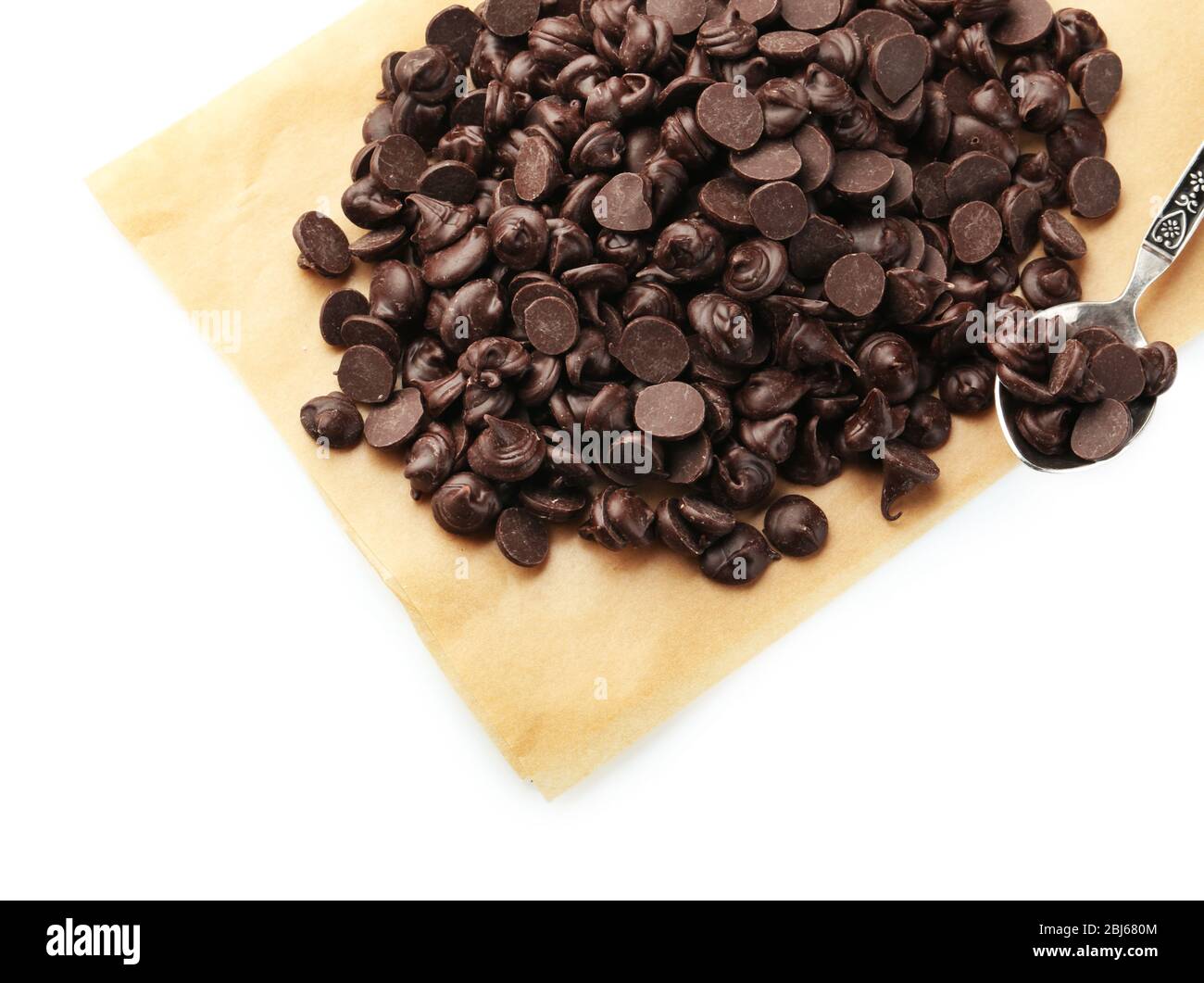 Chocolate morsels isolated on white Stock Photo - Alamy