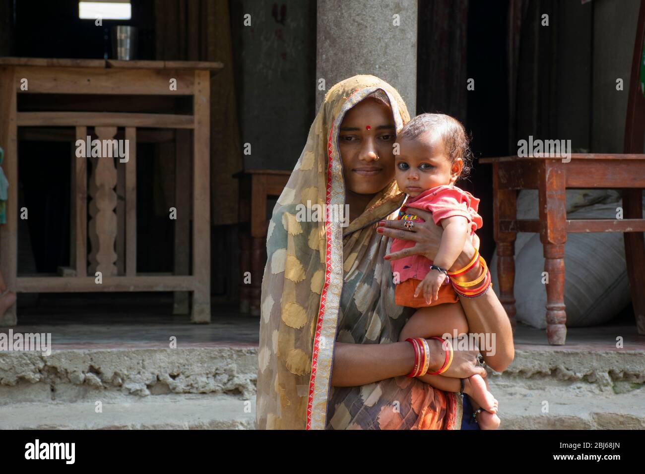 portrait of mother and her child in rural village, India Stock Photo ...