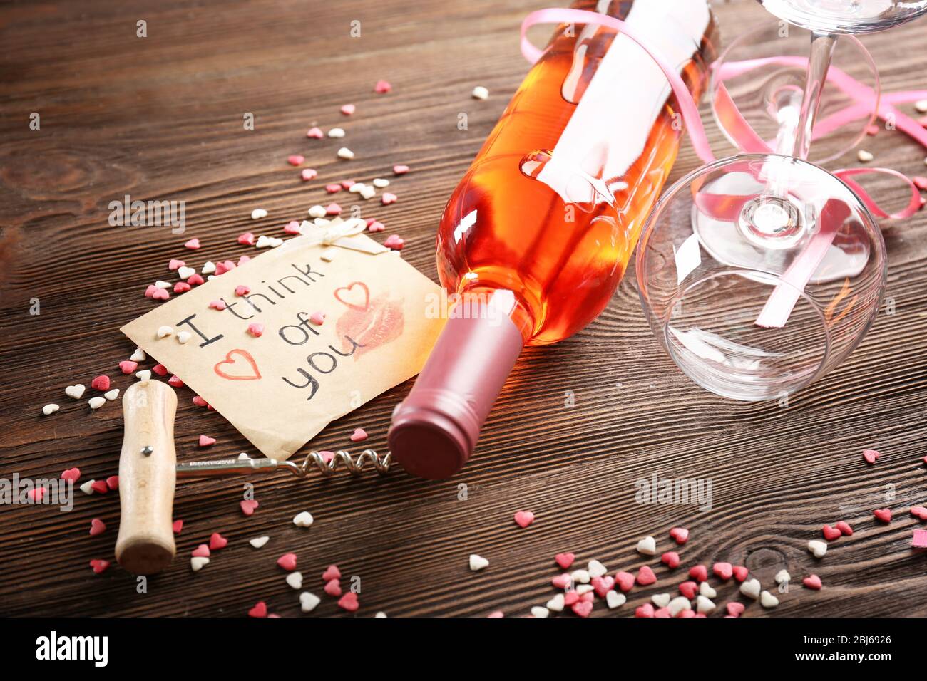 One love, one life concept - wine bottle and glasses with hearts around ...