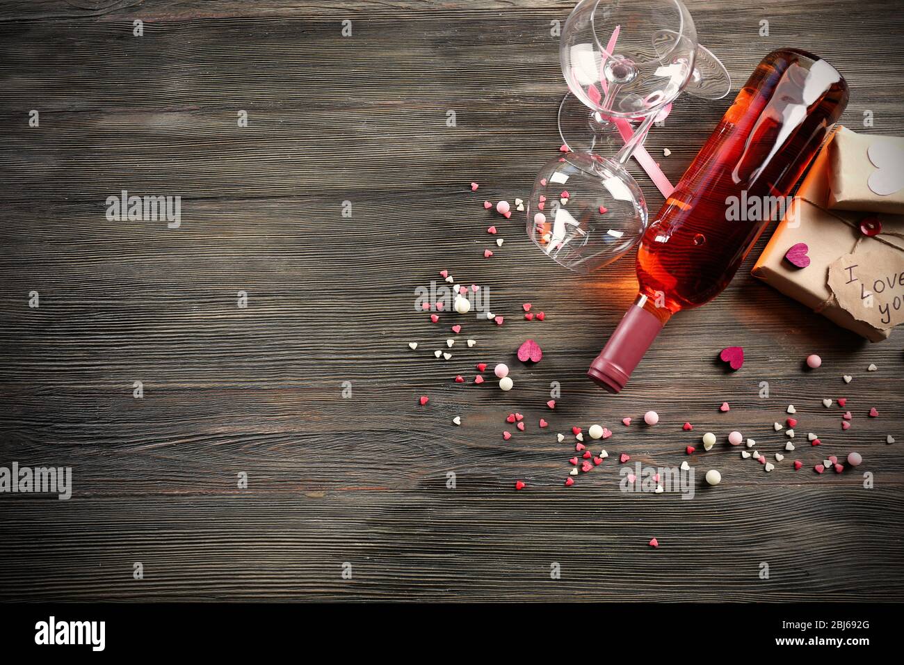 One love, one life concept - wine bottle and glasses with hearts around ...