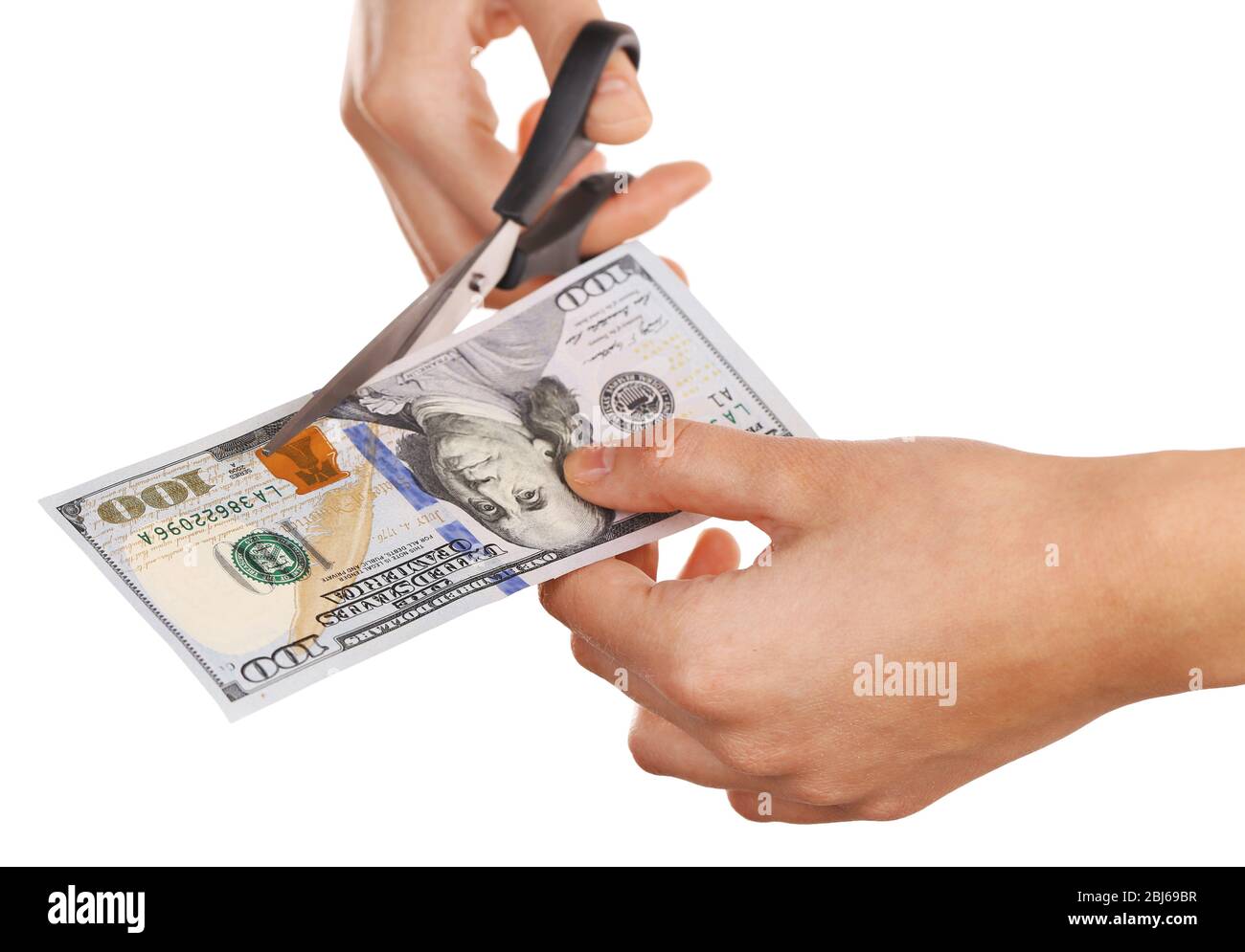 Hands with scissors cutting dollar banknote, isolated on white Stock ...