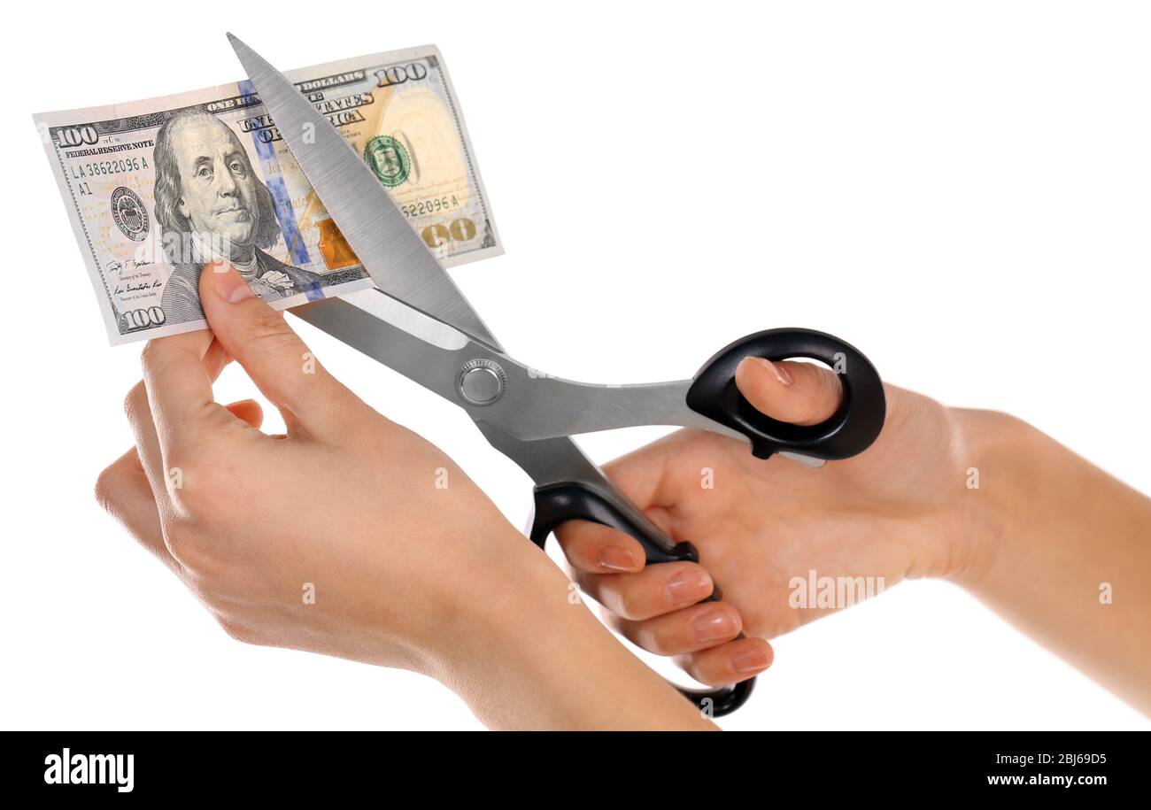 Hands with scissors cutting dollar banknote, isolated on white Stock ...