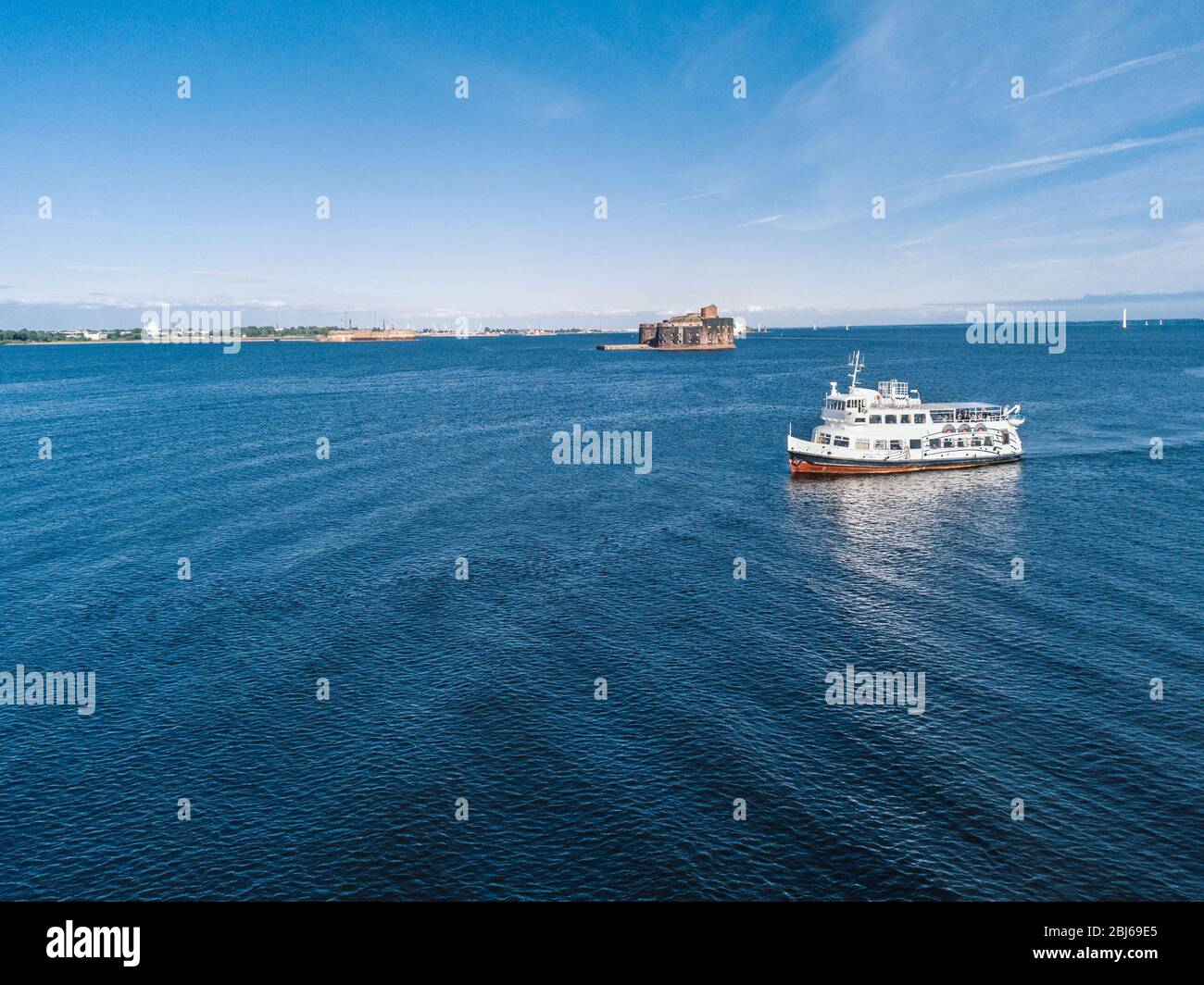 Aerial view of a small white passenger ship going along the Finnish ...