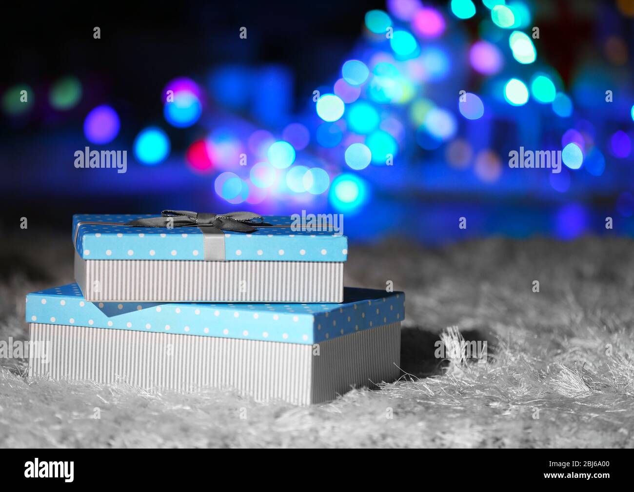 Pile of Christmas gift boxes on the floor, close up Stock Photo - Alamy