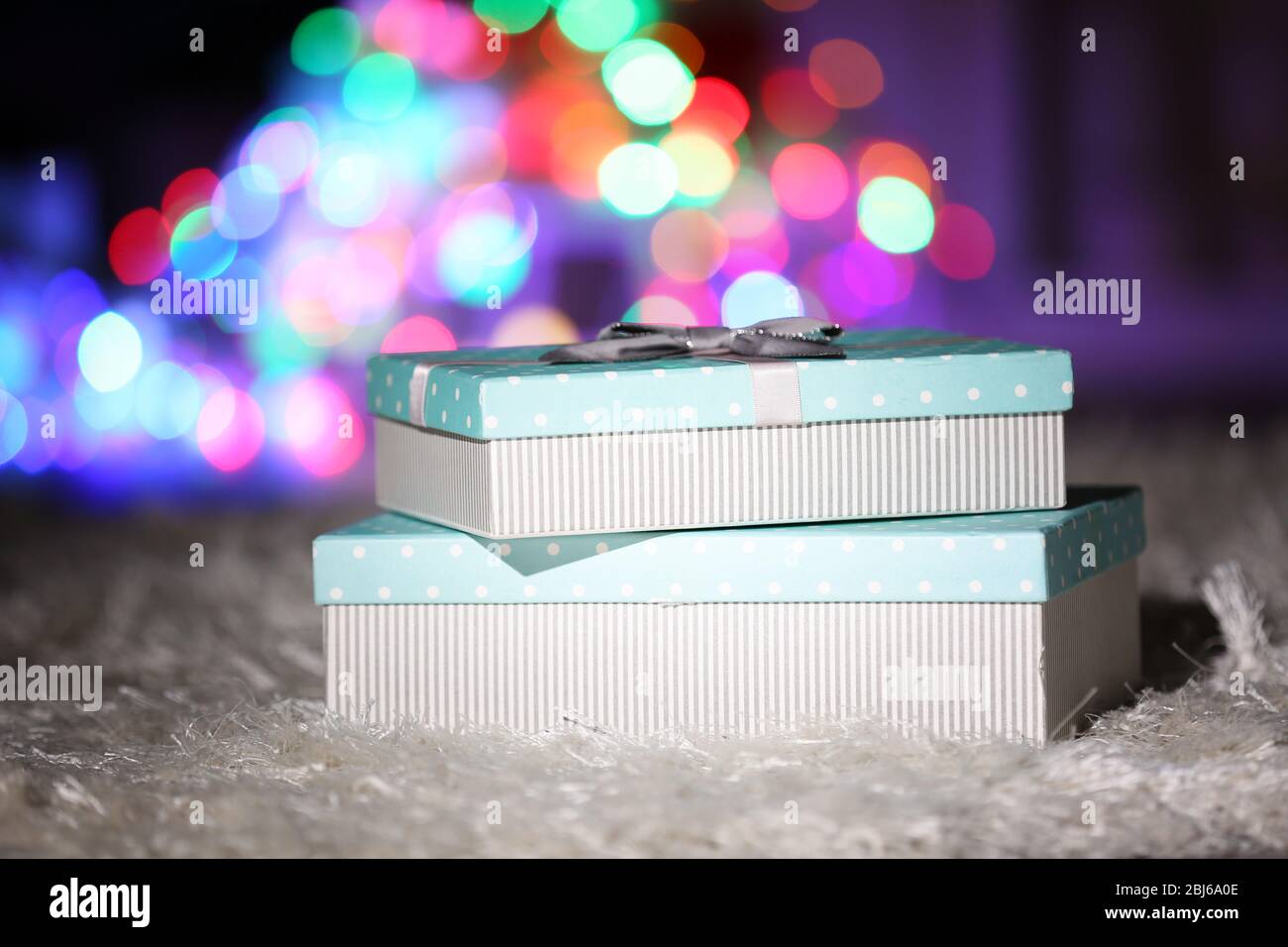 Pile of Christmas gift boxes on the floor, close up Stock Photo - Alamy
