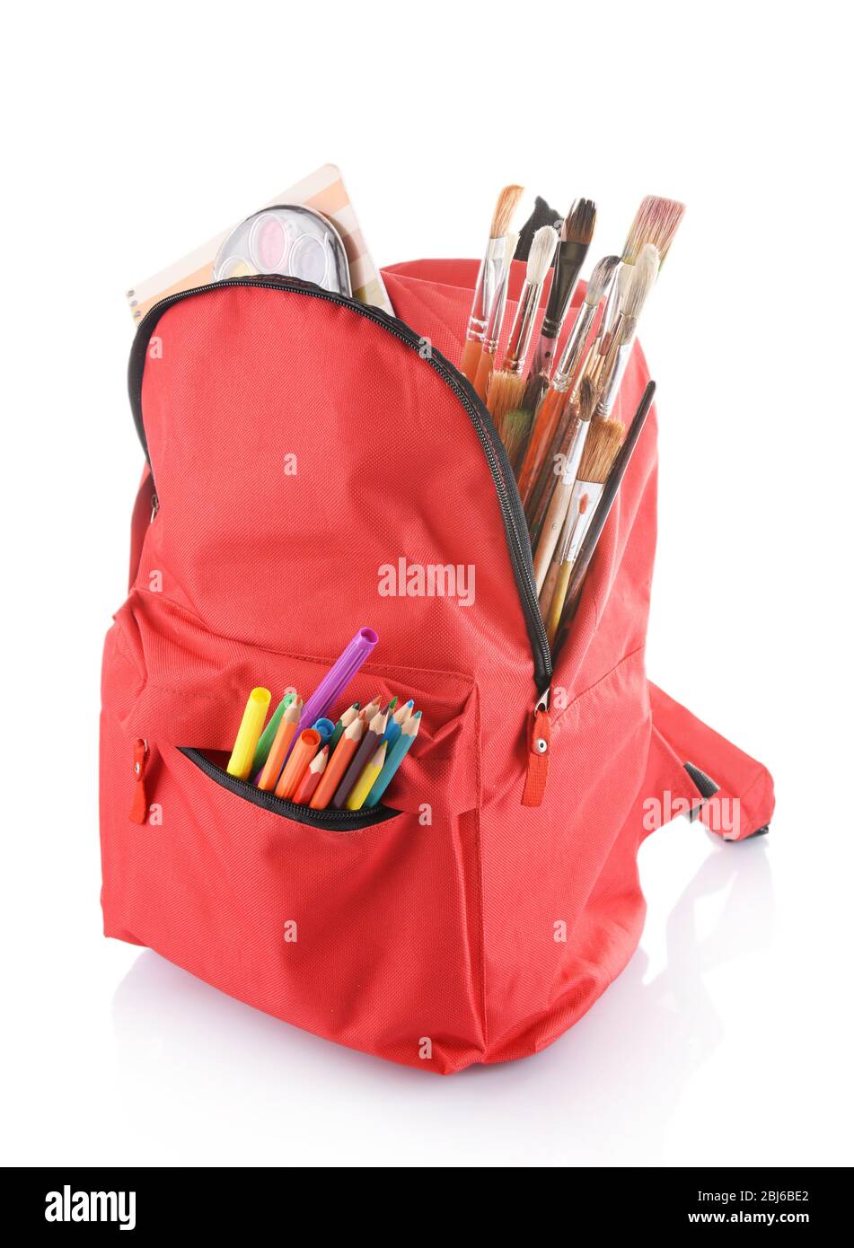 Red backpack with colourful stationary isolated on white background ...