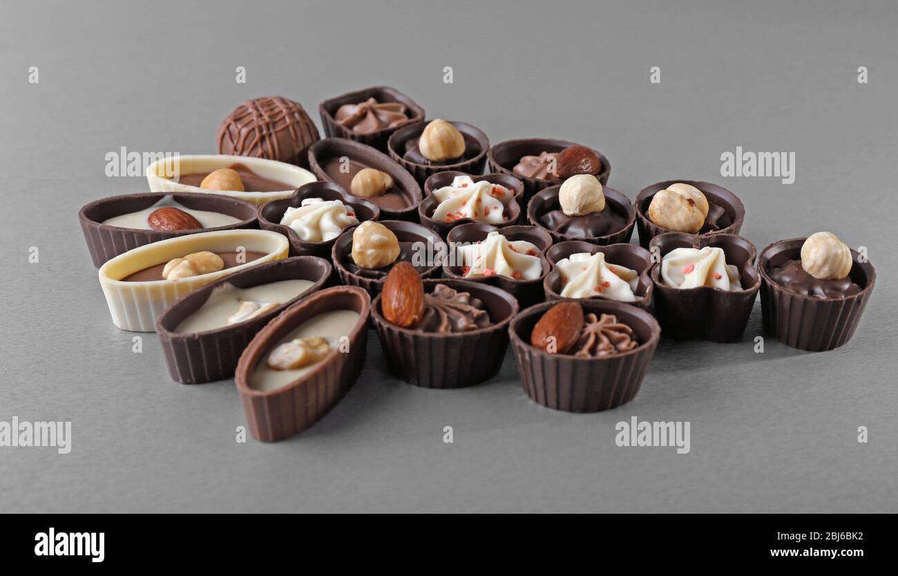 Chocolate sweets on dark grey background Stock Photo - Alamy