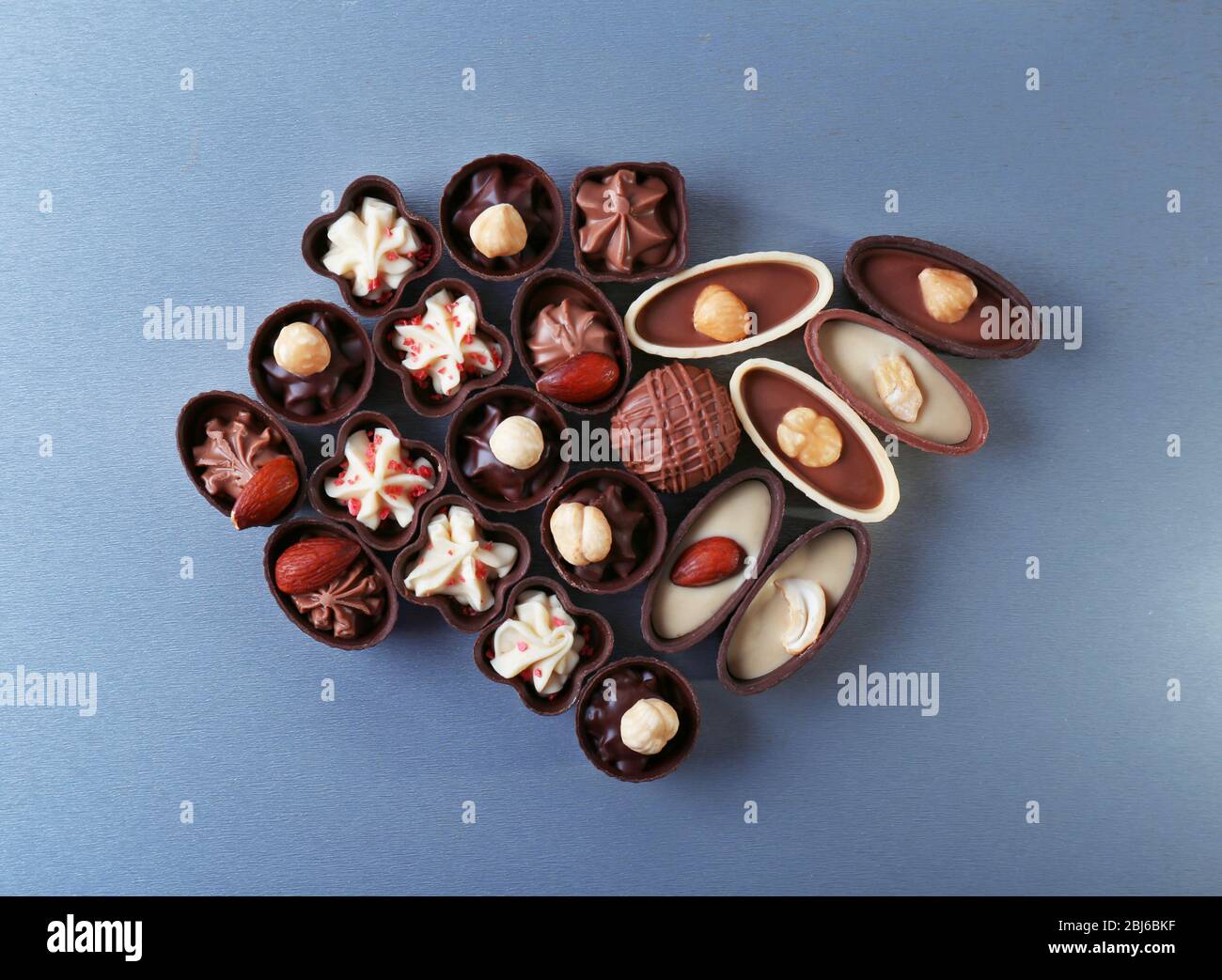 Chocolate sweets on dark grey background Stock Photo - Alamy