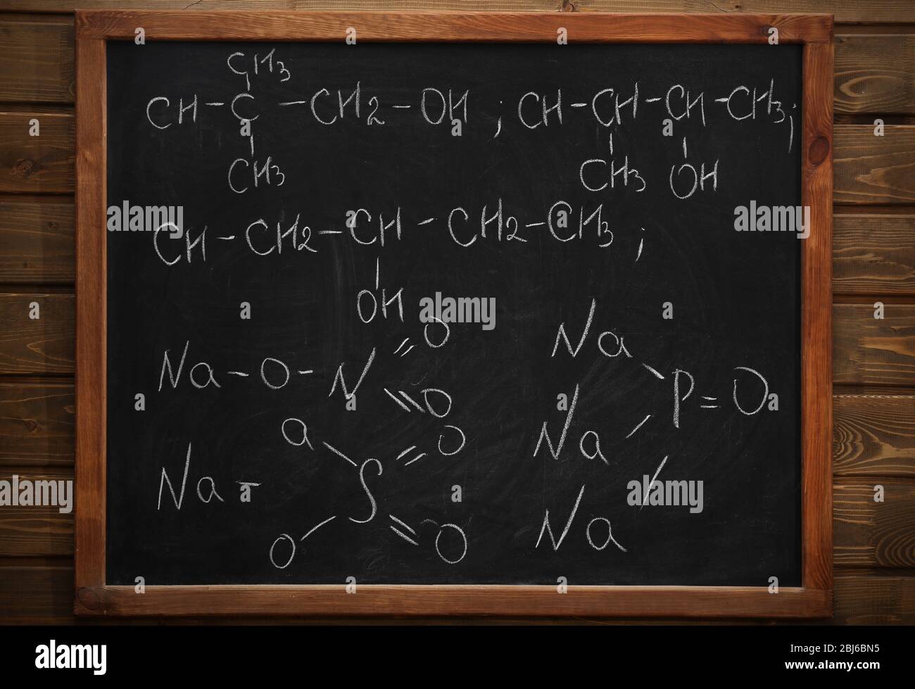 School blackboard with formulas on a brick wall Stock Photo - Alamy