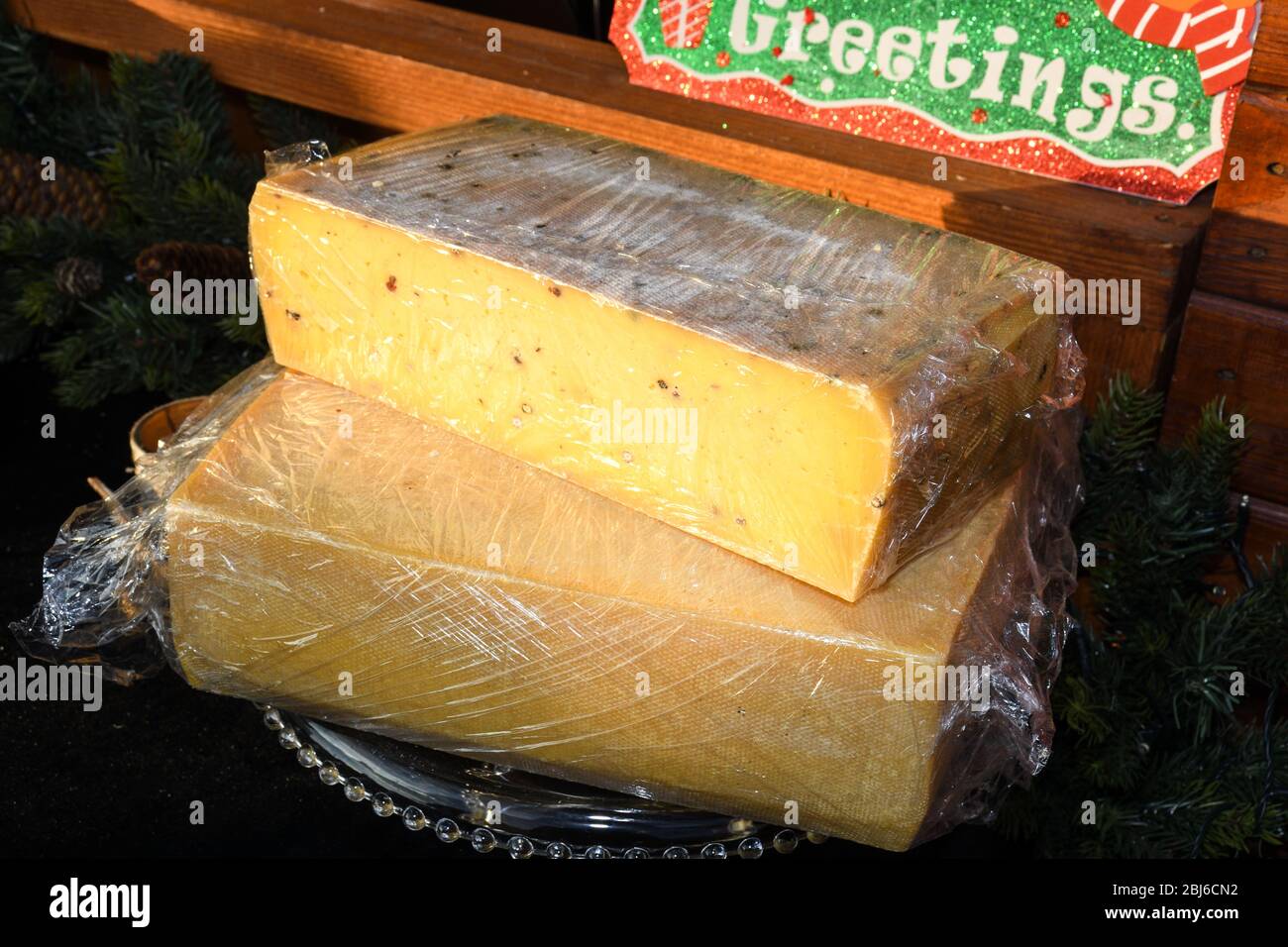 Cheese wheels stack one over another for sale Stock Photo - Alamy