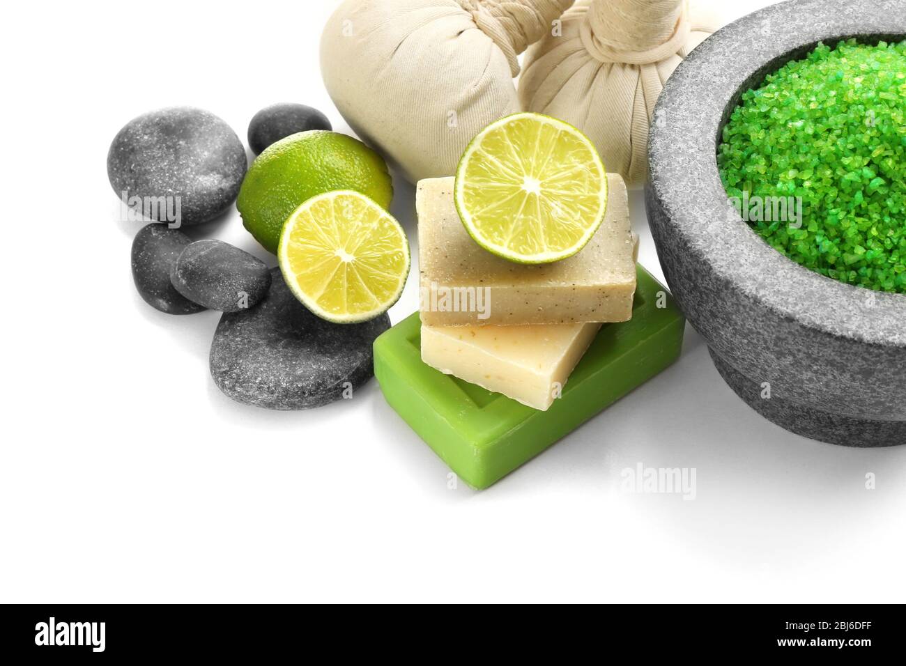 Spa composition with soap, sea salt, pebbles and lime, close up Stock ...