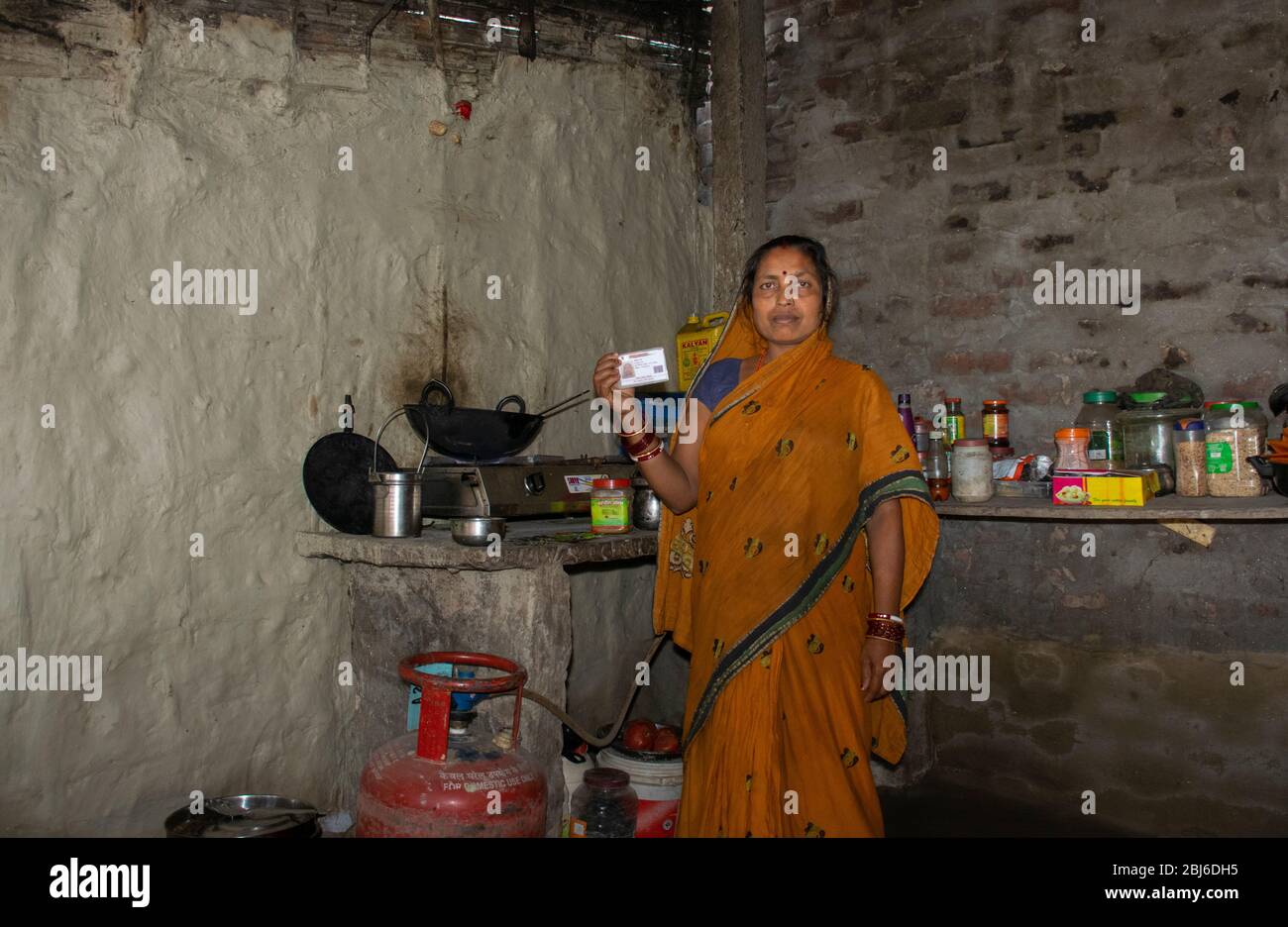 rural woman showing card kitchen, india Stock Photo - Alamy
