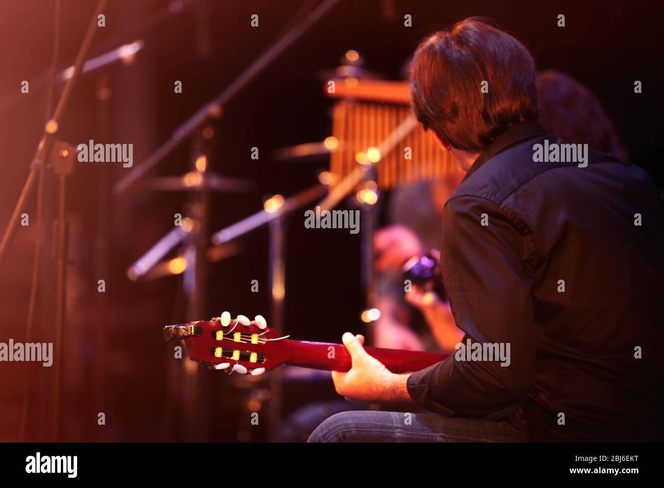 Photo of a musical group at the concert Stock Photo - Alamy