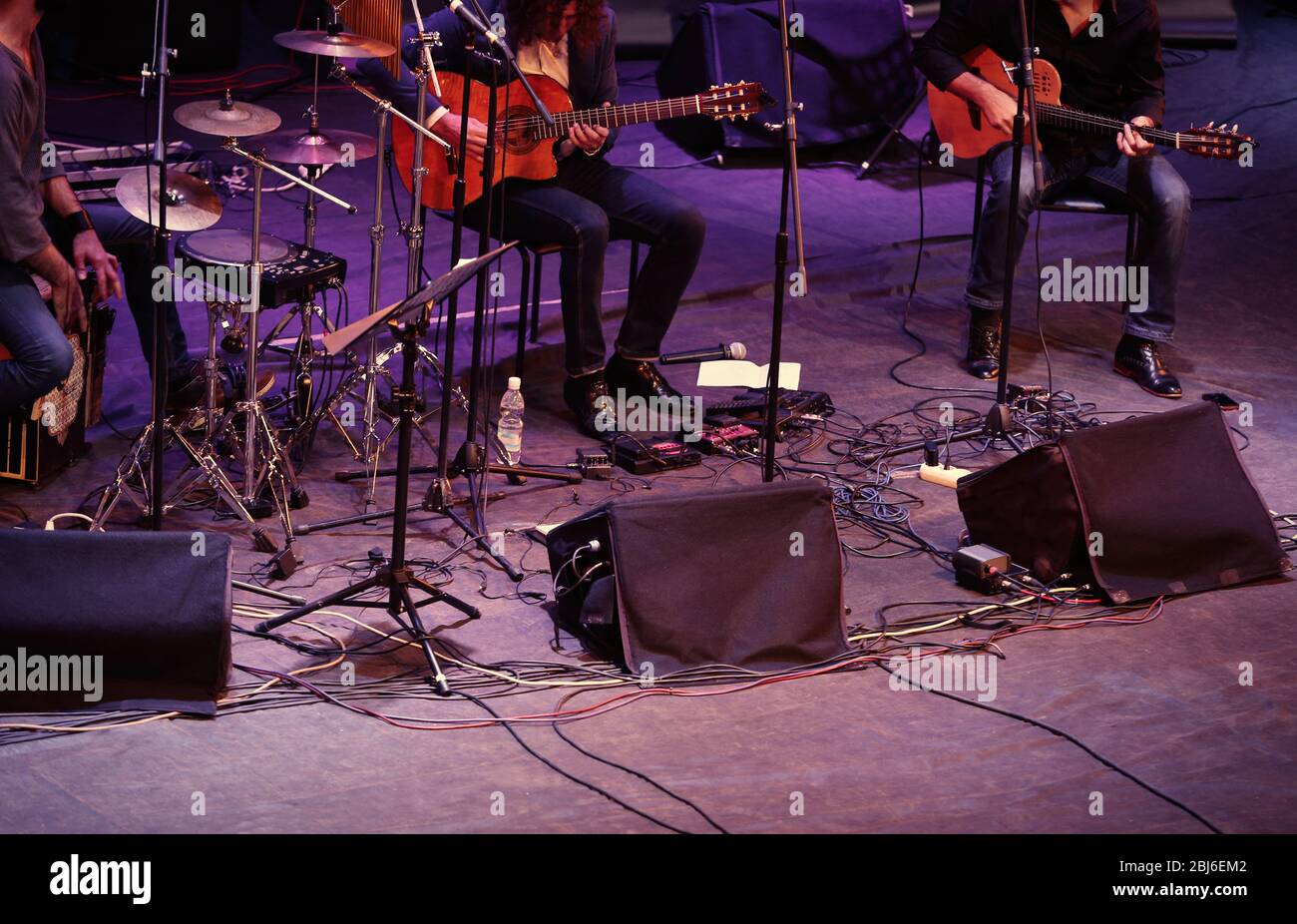 Musical group playing instruments on the stage Stock Photo - Alamy