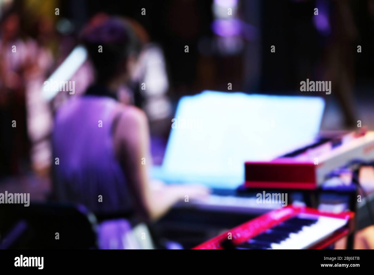 Musician playing the piano at the stage Stock Photo - Alamy