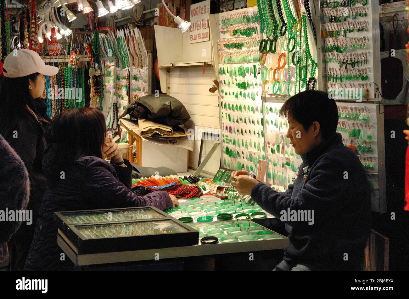 Jade market stallholder, Kowloon, Hong Kong Stock Photo - Alamy