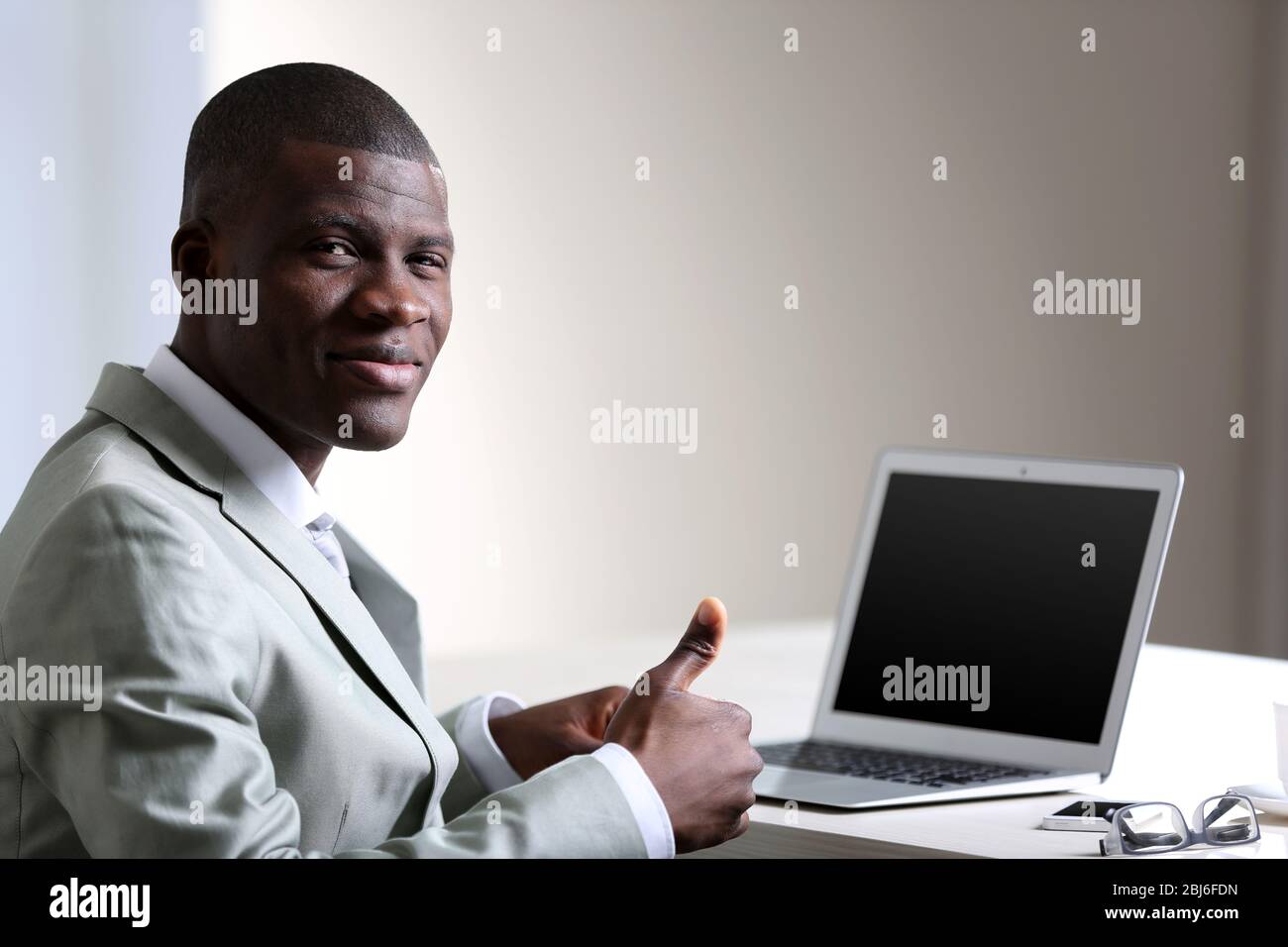 Manager looking over worker shoulder hi-res stock photography and ...