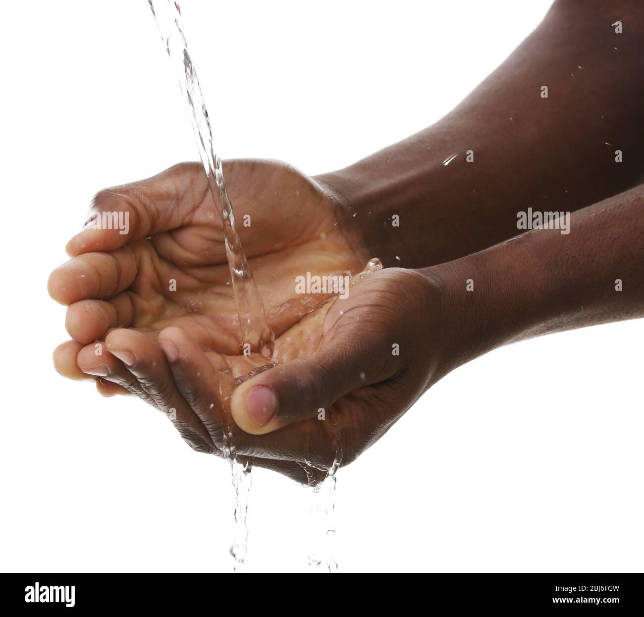Hands washing concept. Water pouring into man hands isolated on white ...