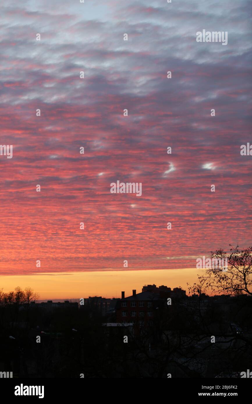 Beautiful sunset sky over the town Stock Photo - Alamy