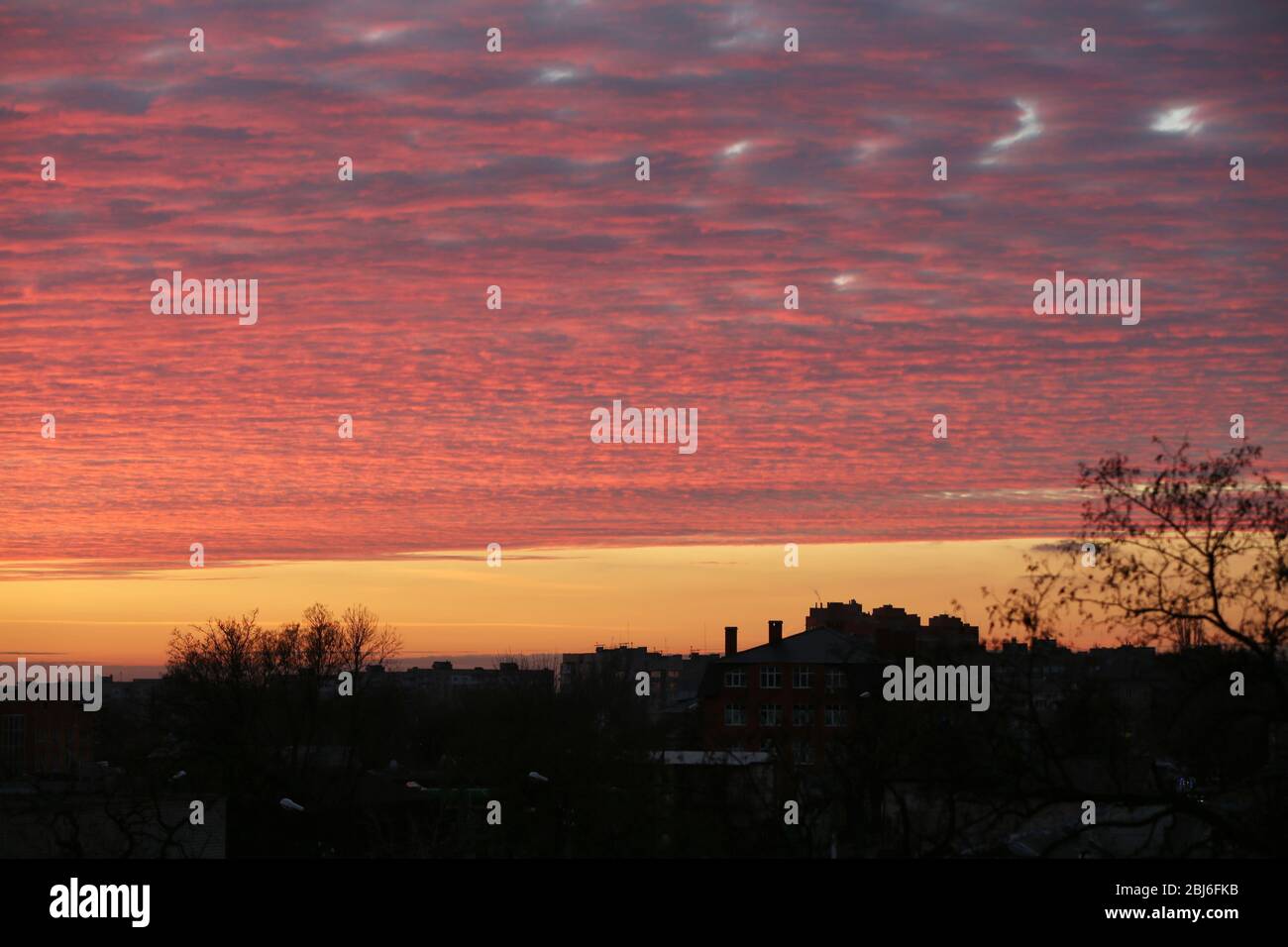 Beautiful sunset sky over the town Stock Photo - Alamy