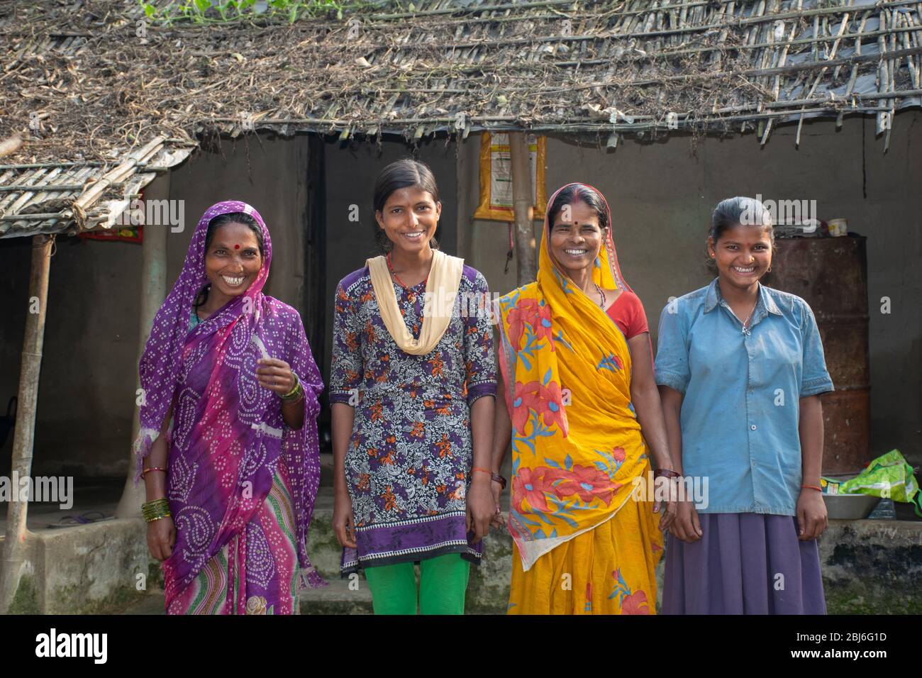 group of village women smiling in front of their house Stock Photo - Alamy