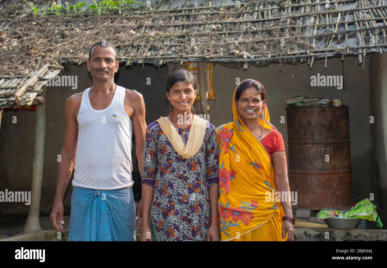 portrait of rural family standing in front of house Stock Photo - Alamy