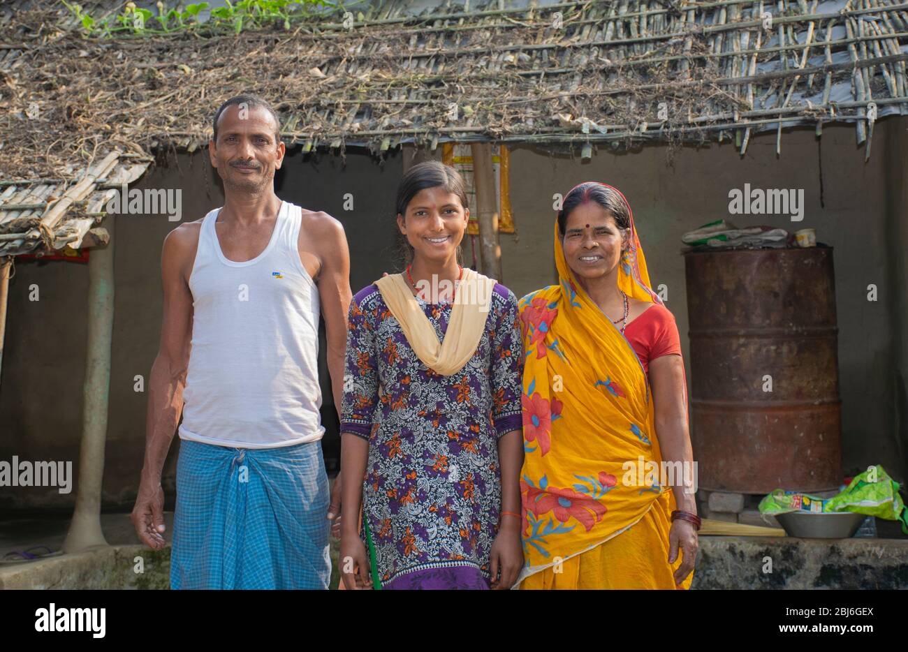 portrait of rural family standing in front of house Stock Photo - Alamy