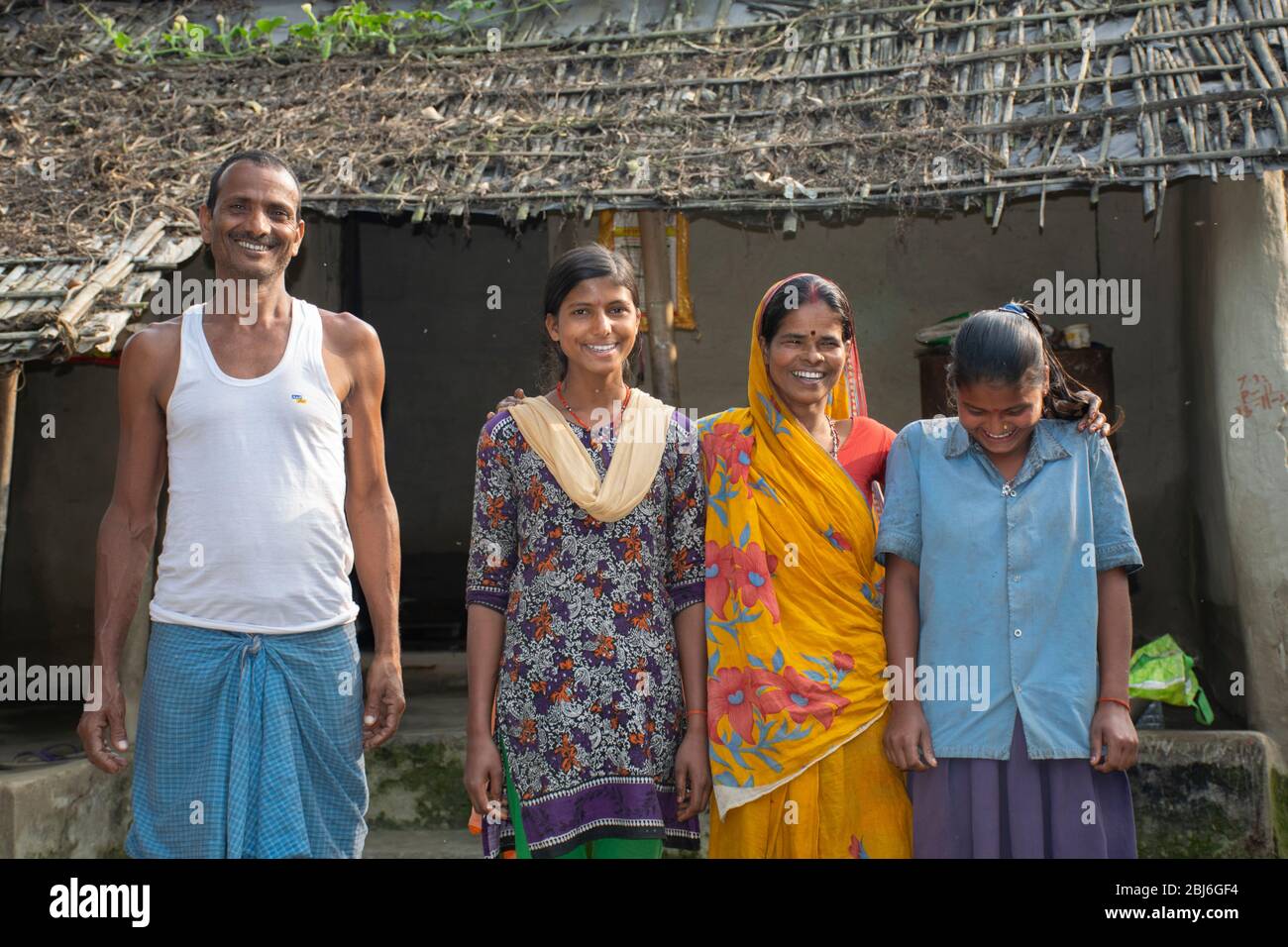 portrait of rural family standing in front of house Stock Photo - Alamy