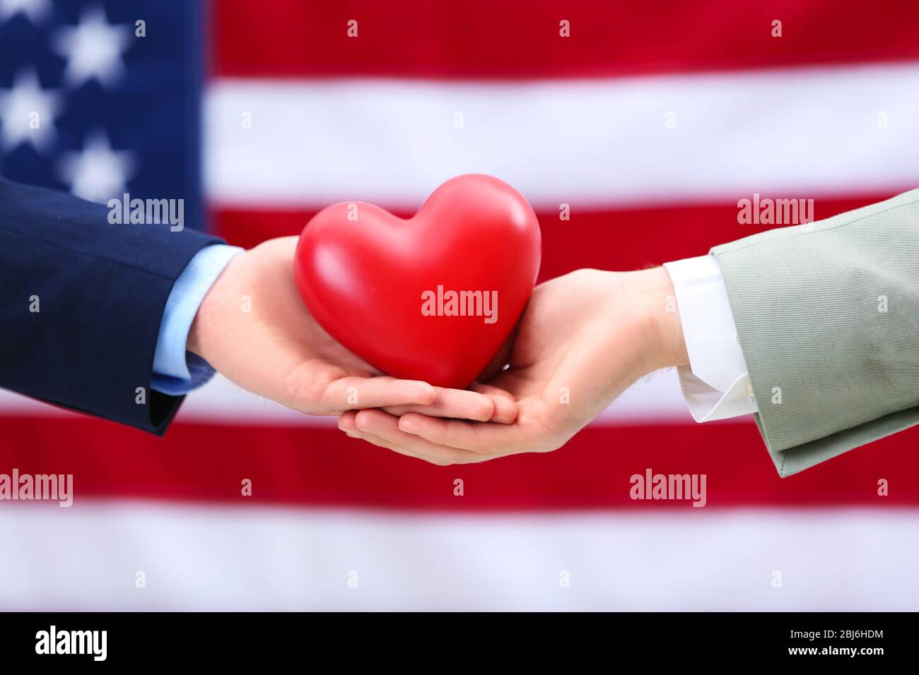 Heart joining two hands hi-res stock photography and images - Alamy