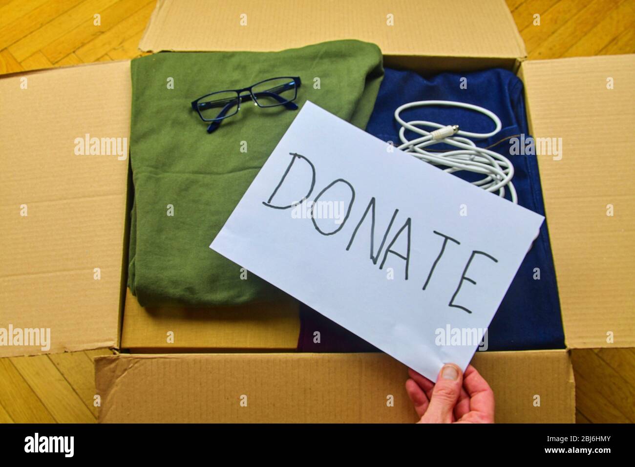Donation concept. Donation box with donation clothes and accesories ...