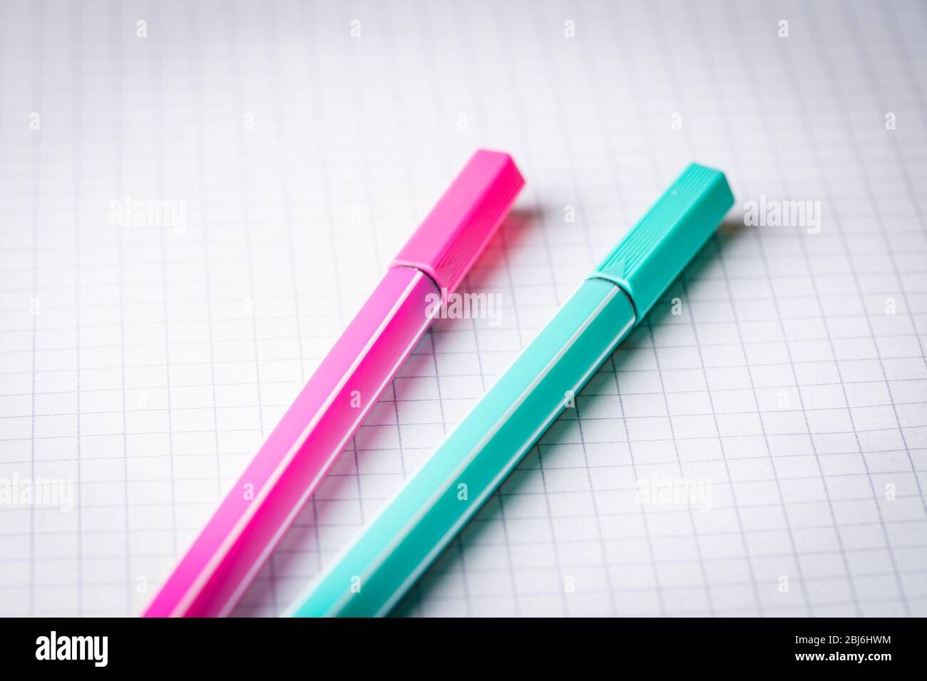 two highlighters on school graph paper Stock Photo - Alamy