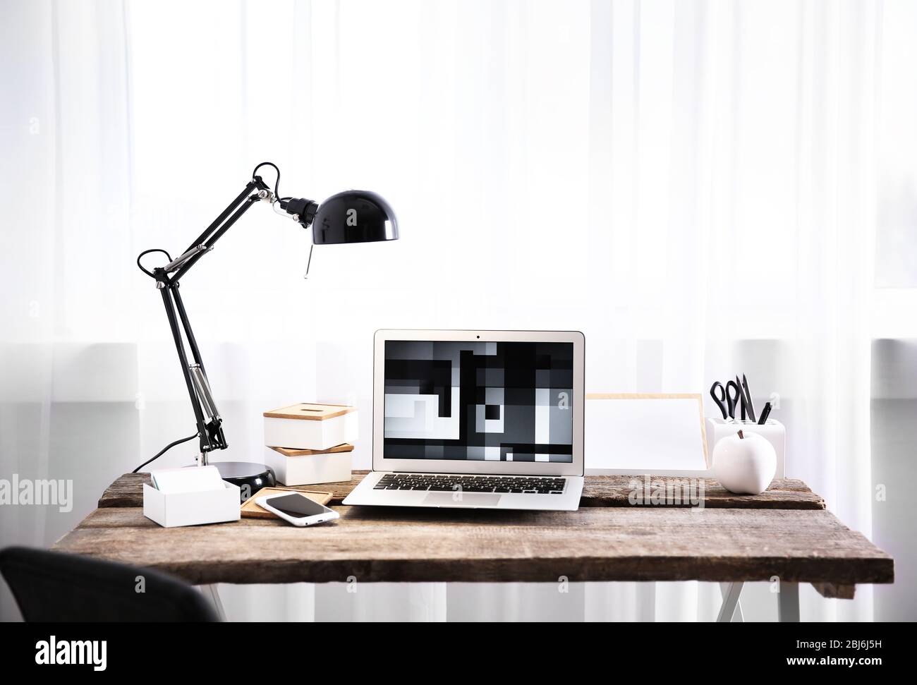 Modern workplace on light background Stock Photo - Alamy