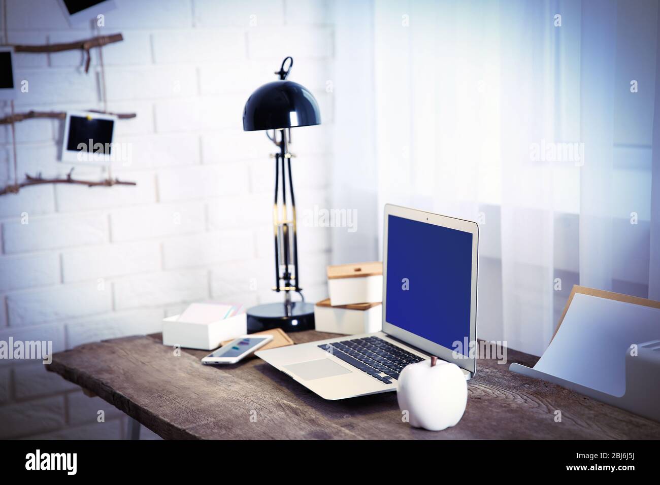 Modern workplace on light background Stock Photo - Alamy
