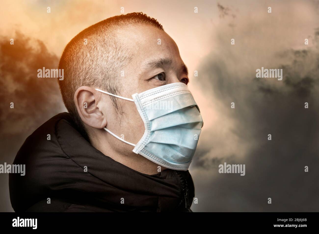 Middle aged Asian man wearing medical face mask Stock Photo - Alamy
