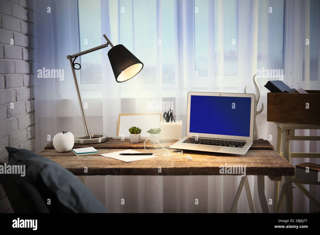 Modern workplace on light background Stock Photo - Alamy