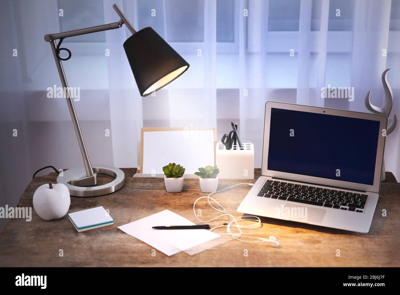 Modern workplace on light background Stock Photo - Alamy