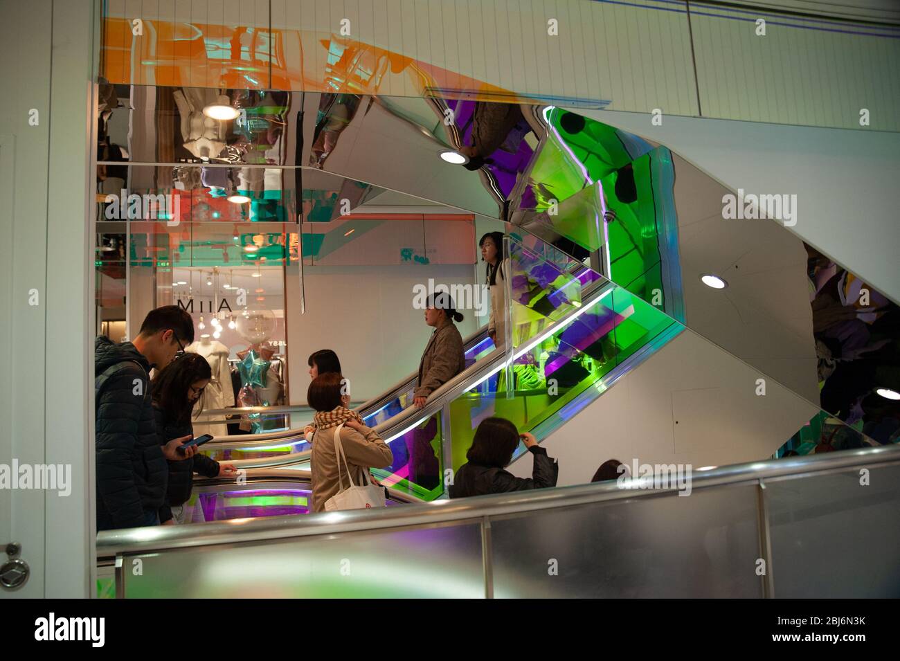 shoppers use the escalators inside 109 department store building, at ...