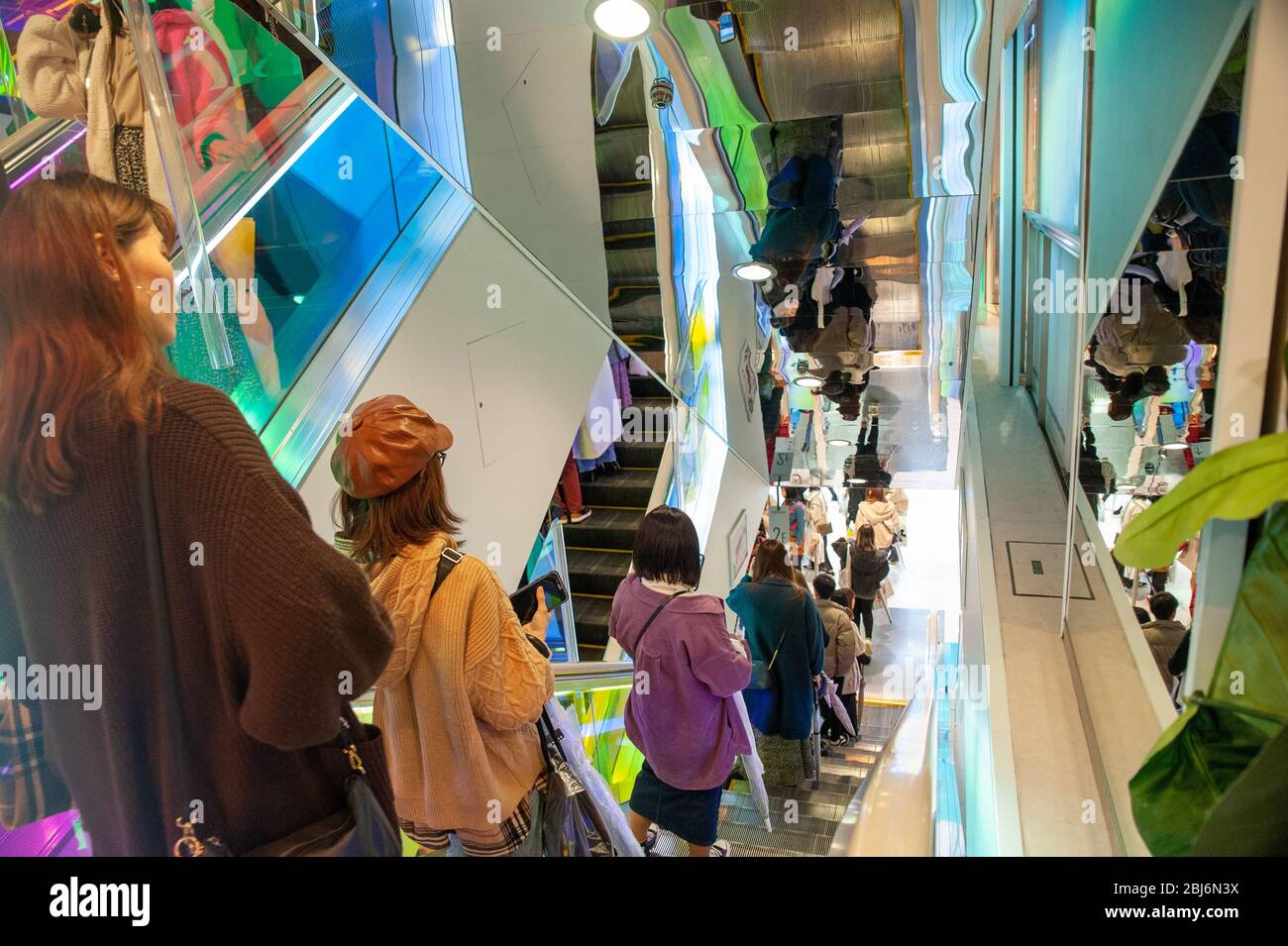shoppers use the escalators inside 109 department store building, at ...